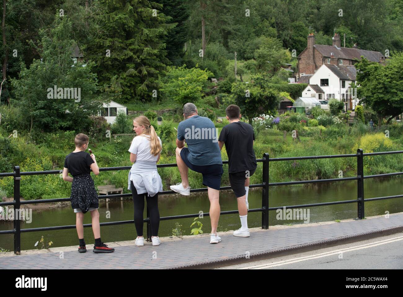 A family watching the River Severn in Ironbridge, Shropshire Stock ...