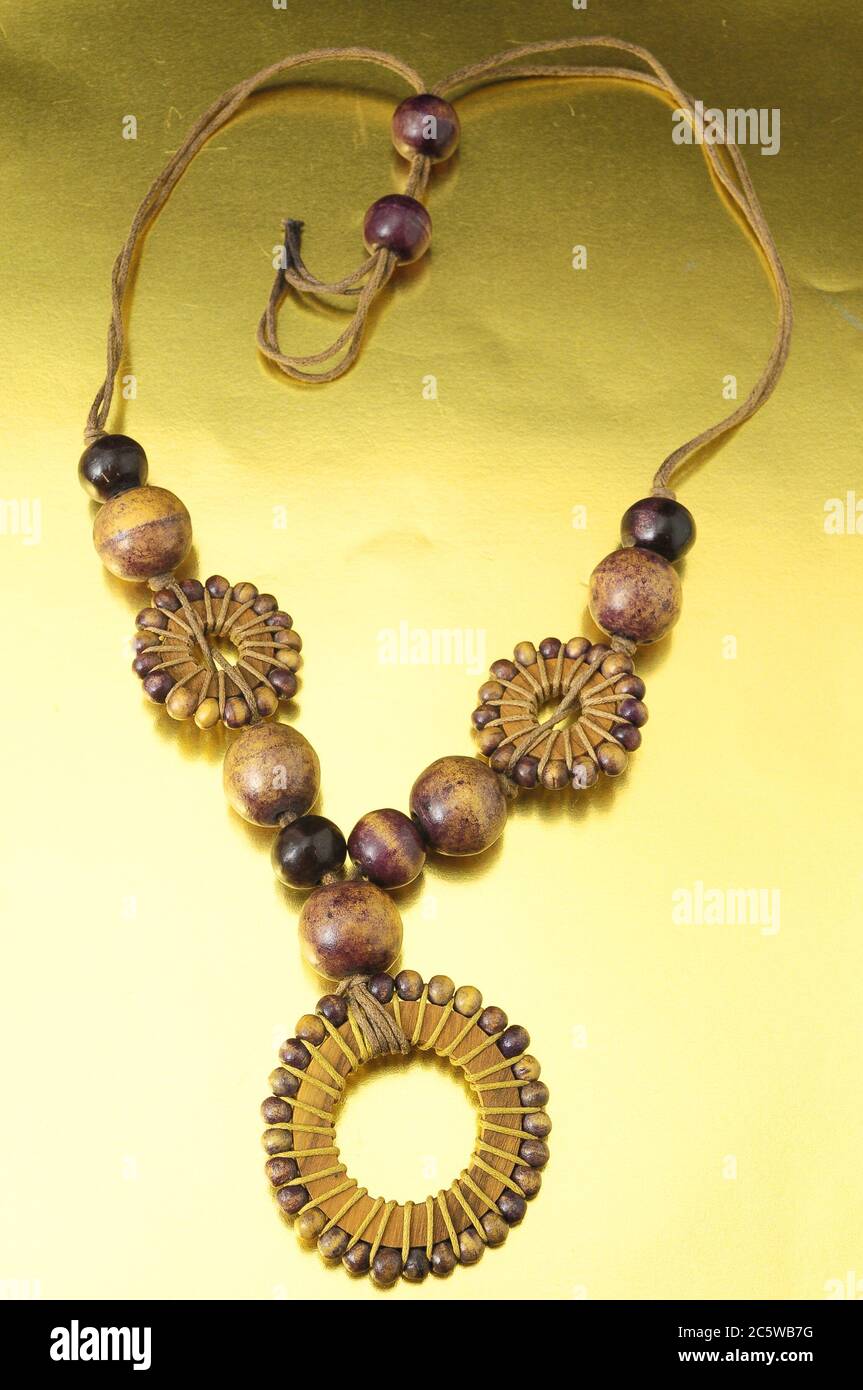 Handmade Wood Collar Necklace on a Colored Background Stock Photo - Alamy