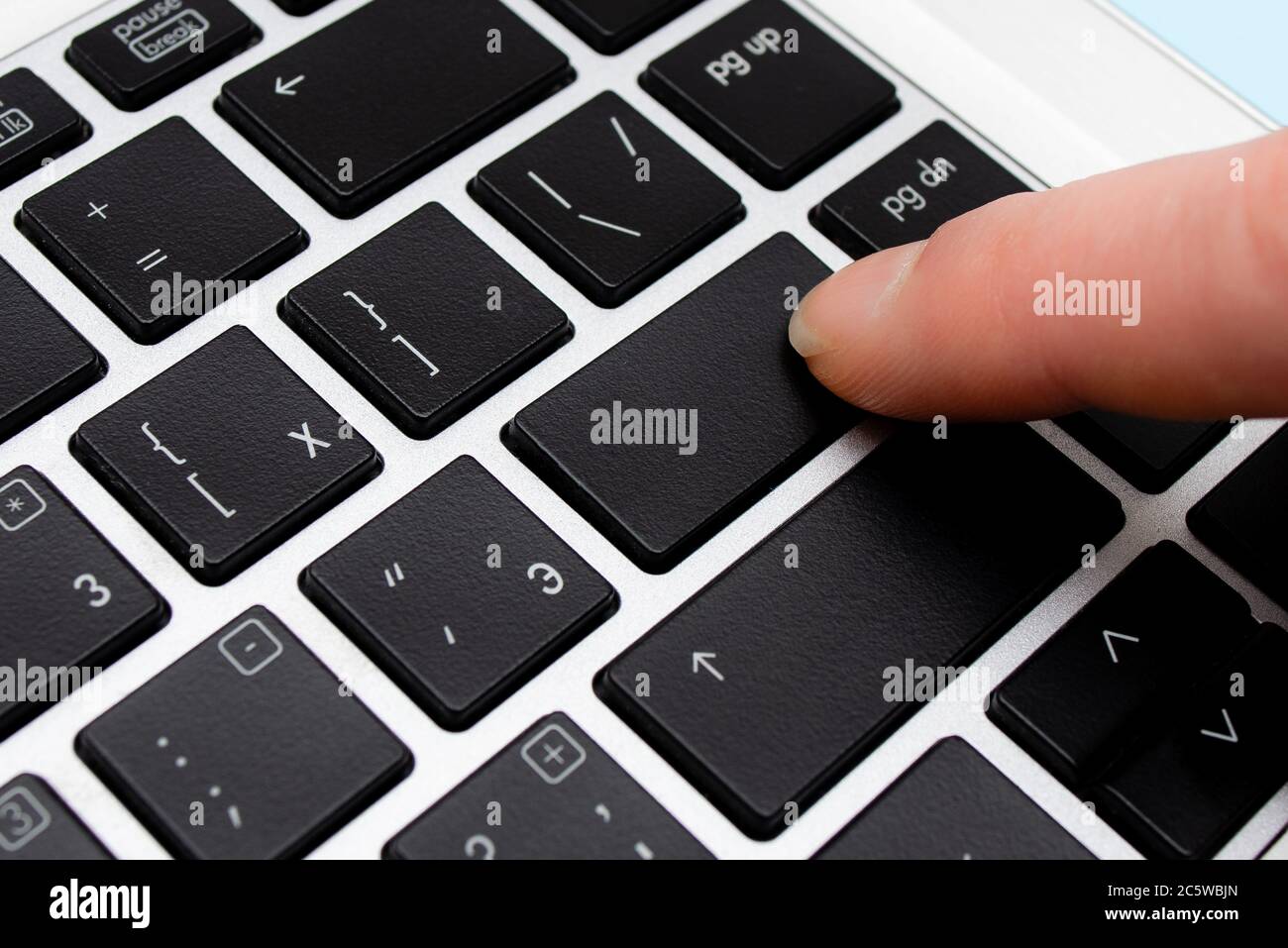 Pc keyboard key with pointing finger above background copy space Stock ...