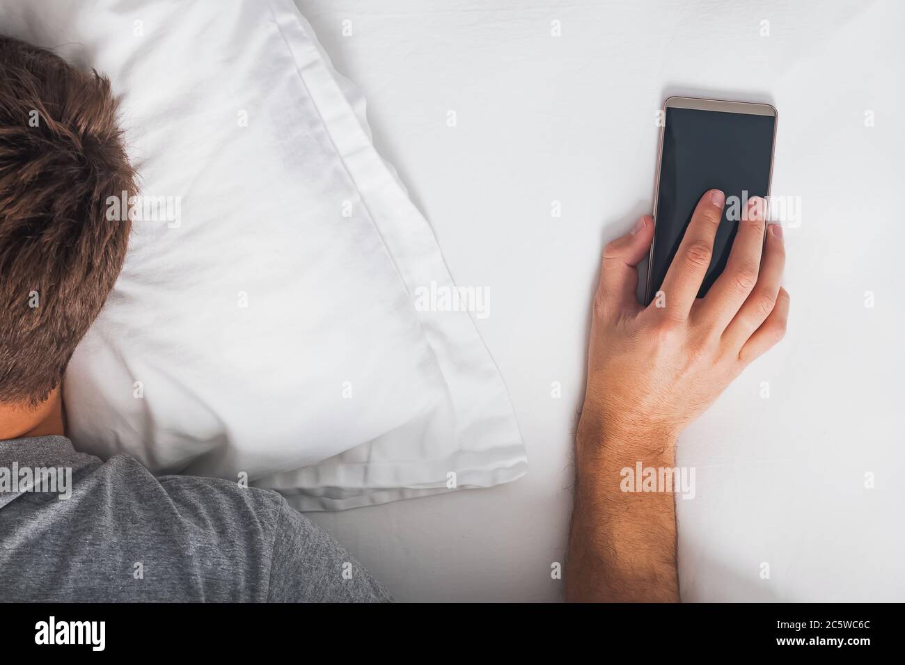 Hand reaching for phone hi-res stock photography and images - Alamy