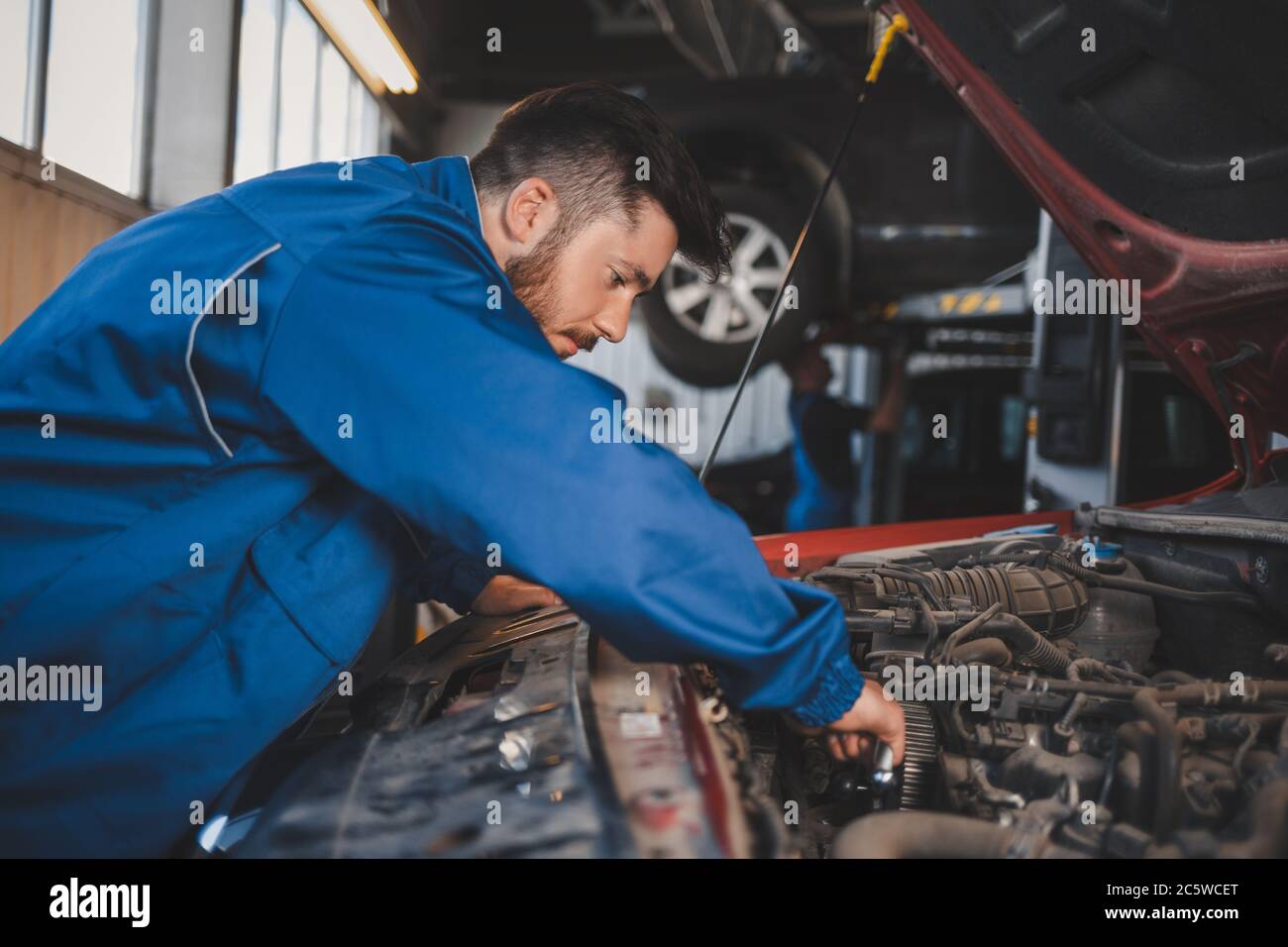 Car mechanic in uniform auto hi-res stock photography and images - Alamy