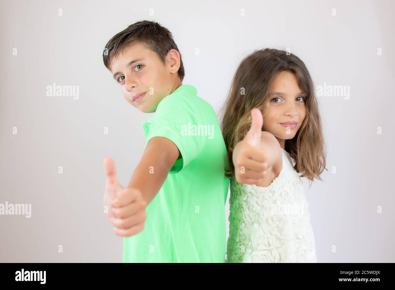 Two friends making funny gestures Stock Photo - Alamy