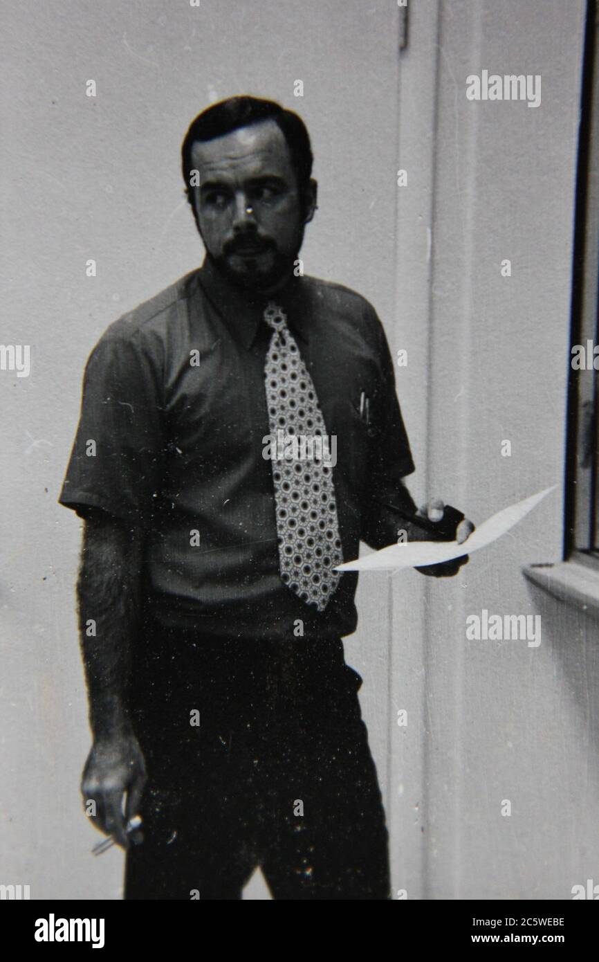 Fine 70s vintage black and white lifestyle professional man on the job ...