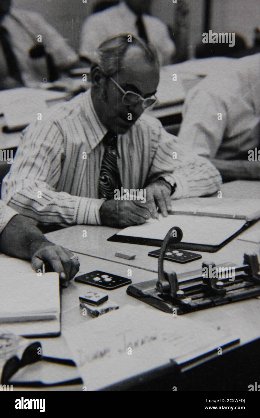 Fine 70s vintage black and white lifestyle professional man on the job ...