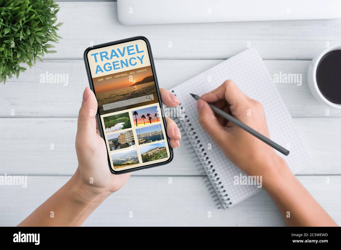 Woman Holding Smartphone With Opened Online Travel Agency App And ...