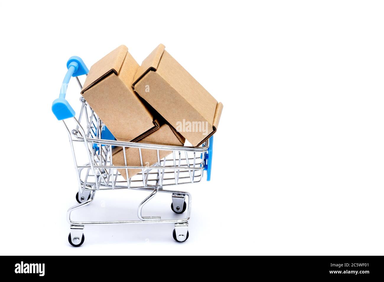 Shopping cart full of cardboard boxes, isolated on white background ...