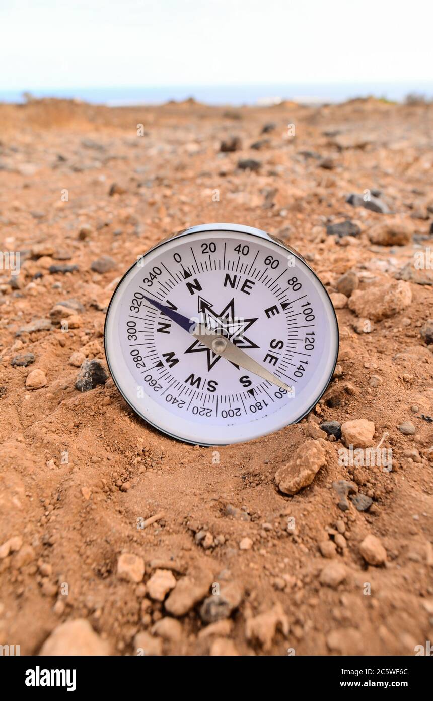 Orientation Concept Metal Compass on a Rock in the Desert Stock Photo ...