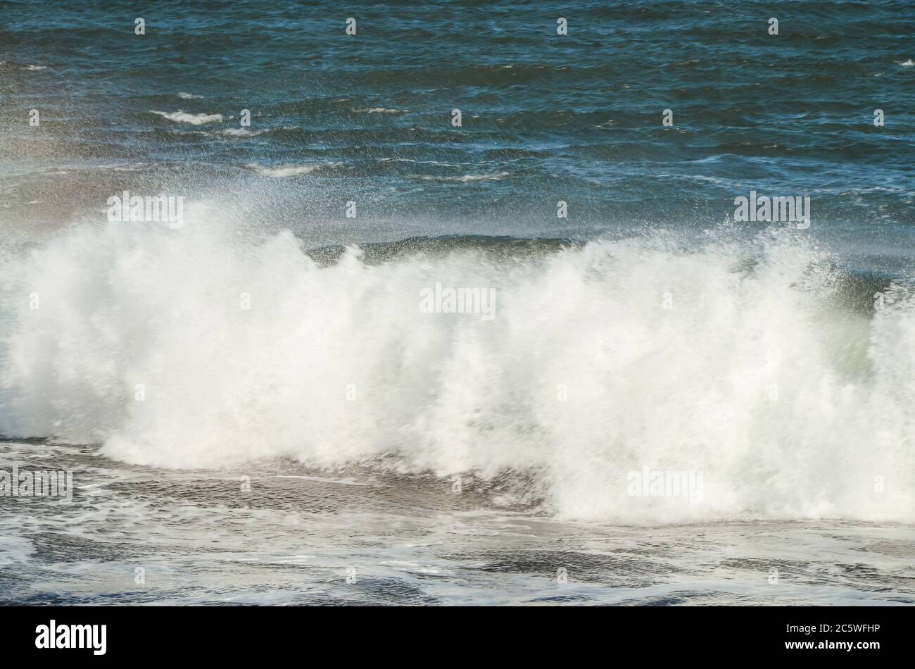 Big Blue Wave Breaks in the Atlantic Ocean Stock Photo - Alamy