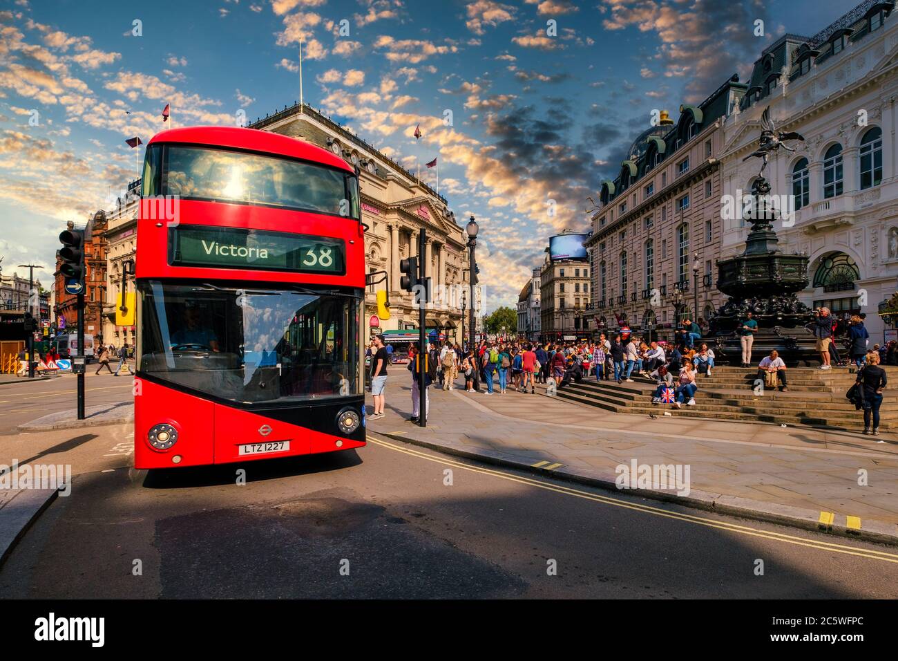 A traditional red double decker bus at the worldwide famous Piccadilly ...