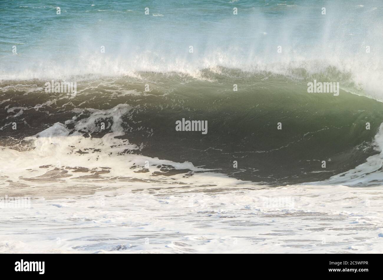 Big Blue Wave Breaks in the Atlantic Ocean Stock Photo - Alamy