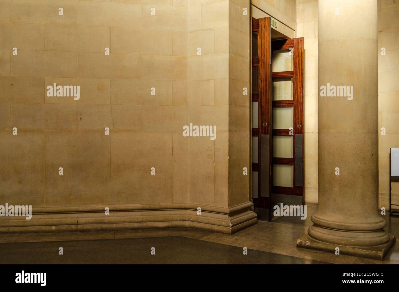 Museum column and exit door Stock Photo - Alamy