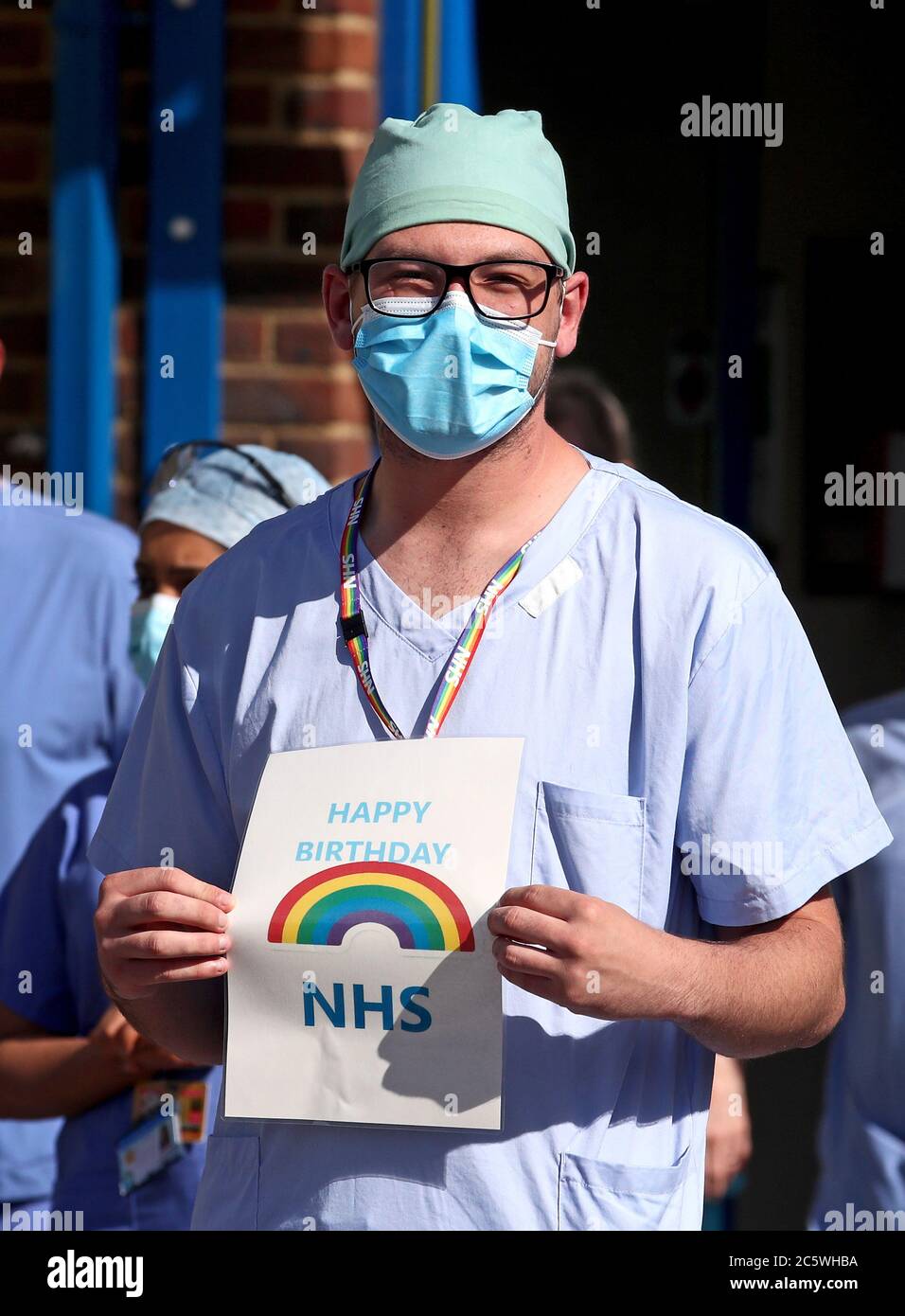 NHS staff outside the William Harvey Hospital in Ashford, Kent, join in ...