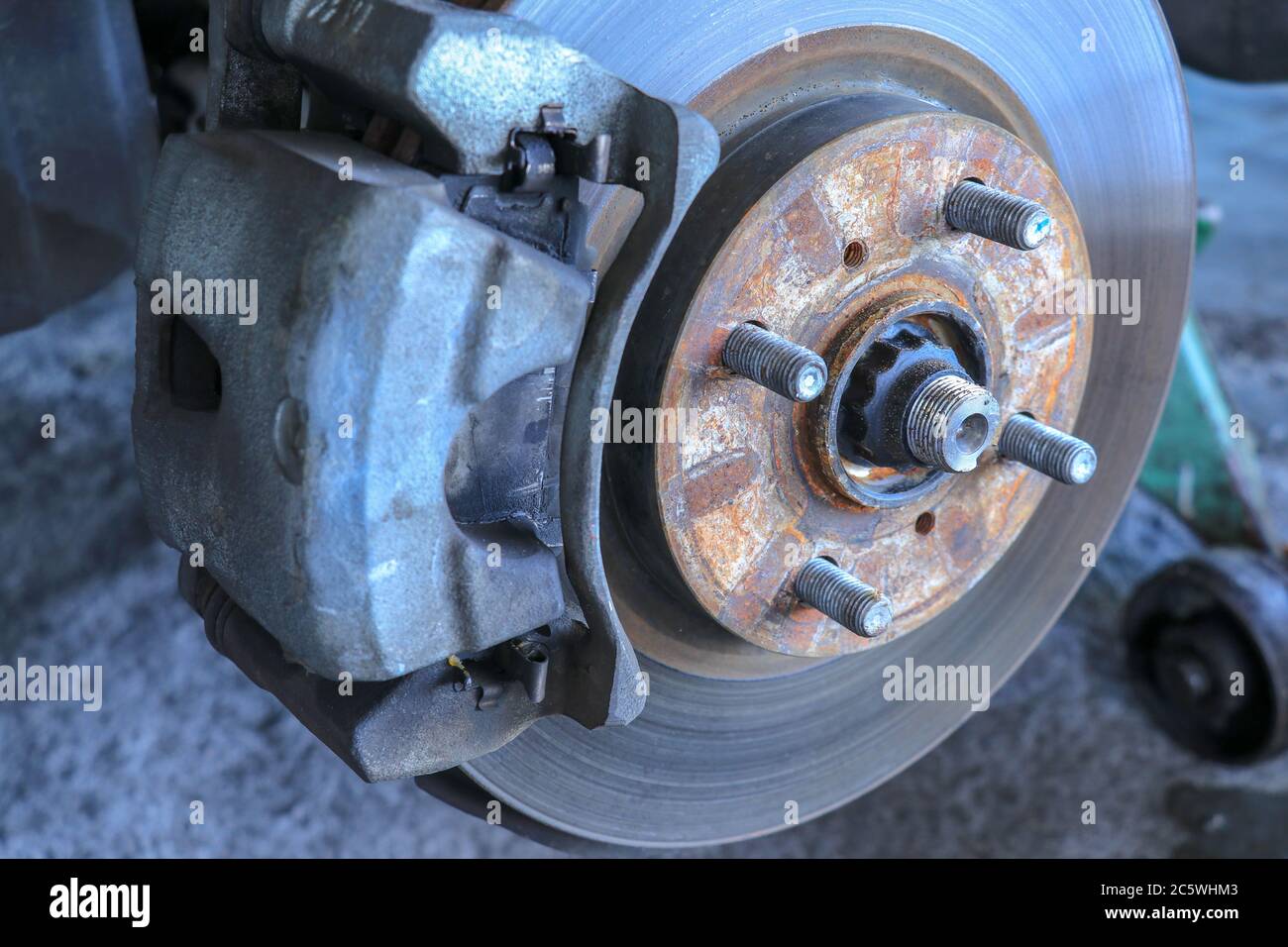 Front disc brake on car in process of new tire replacement Stock Photo ...