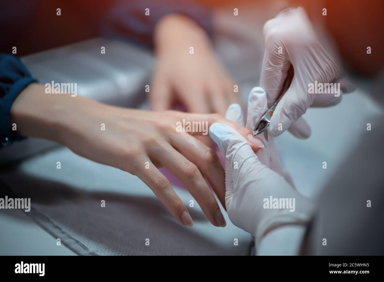 Beautician giving manicure treatment hi-res stock photography and ...
