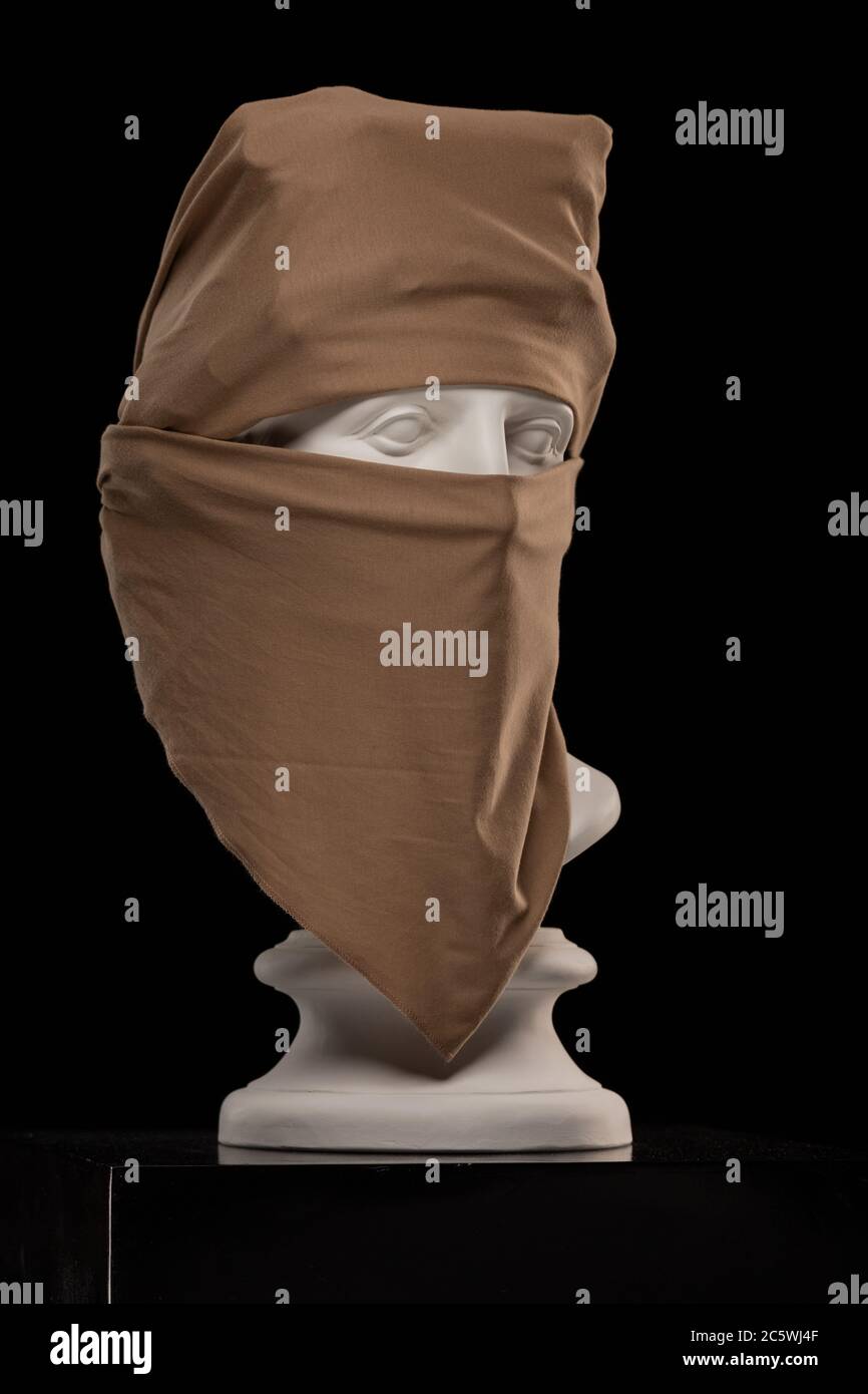 White plaster statue of a bust of Apollo Belvedere in hijab niqab Stock ...