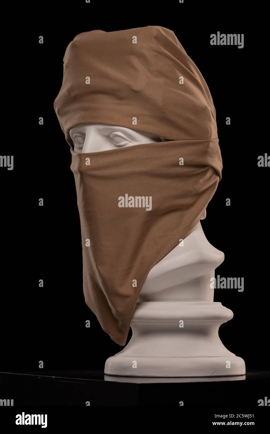 White plaster statue of a bust of Apollo Belvedere in hijab niqab Stock ...