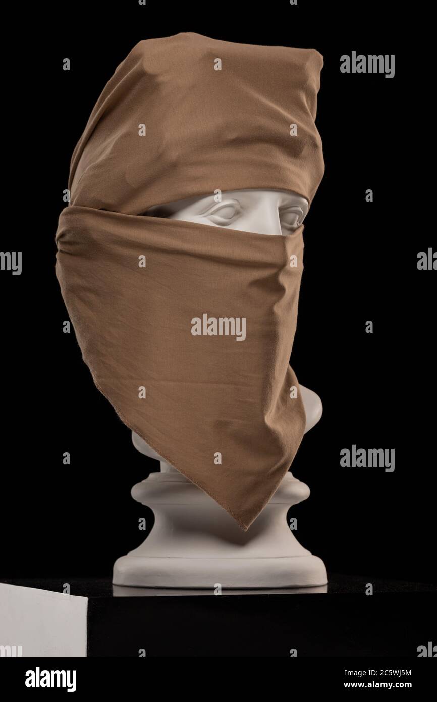 White plaster statue of a bust of Apollo Belvedere in hijab niqab Stock ...