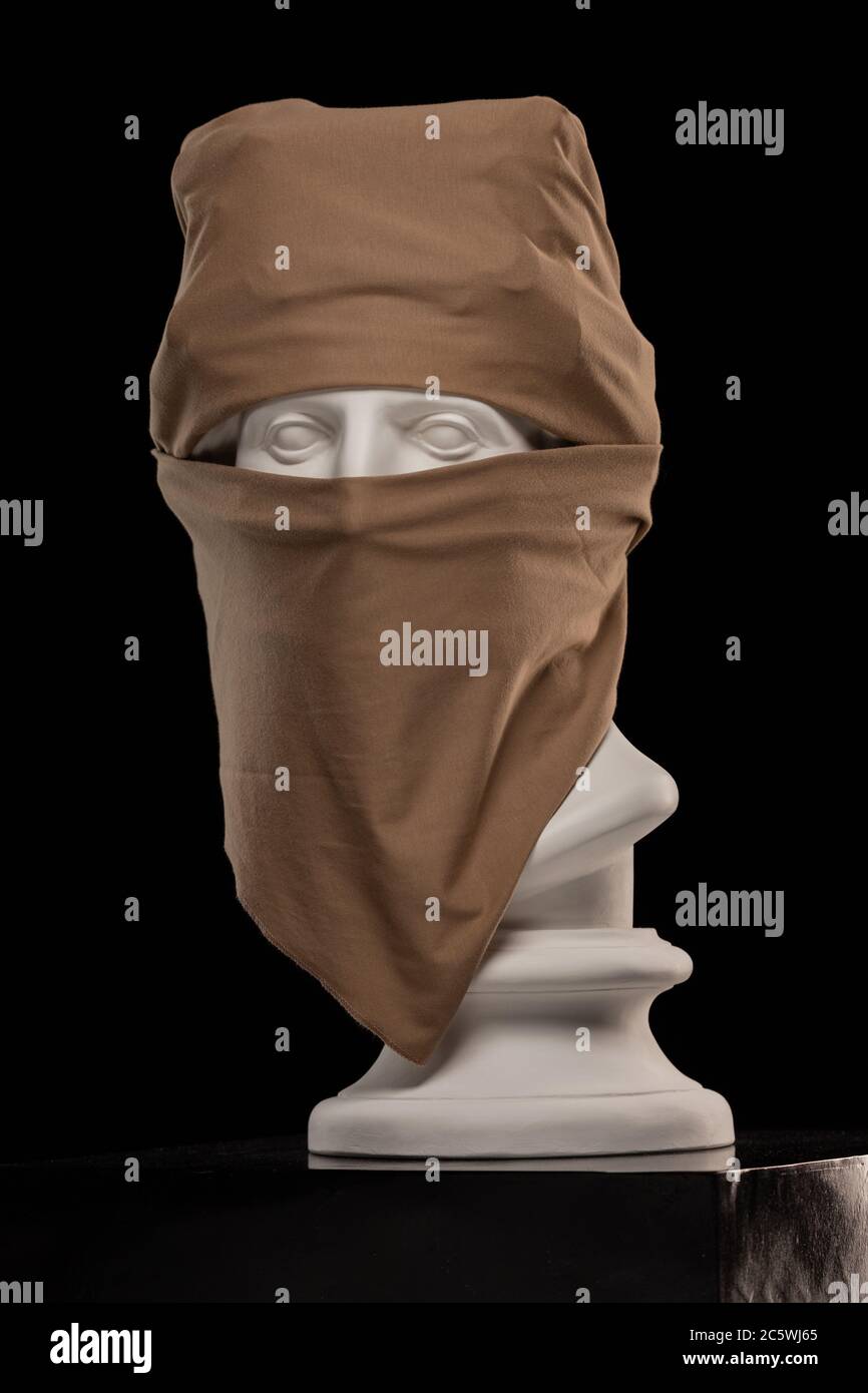 White plaster statue of a bust of Apollo Belvedere in hijab niqab Stock ...