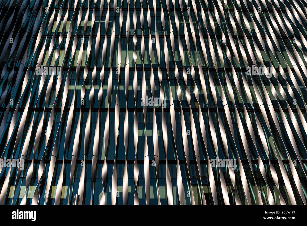 External blinds near the windows reflect light from the building Stock ...