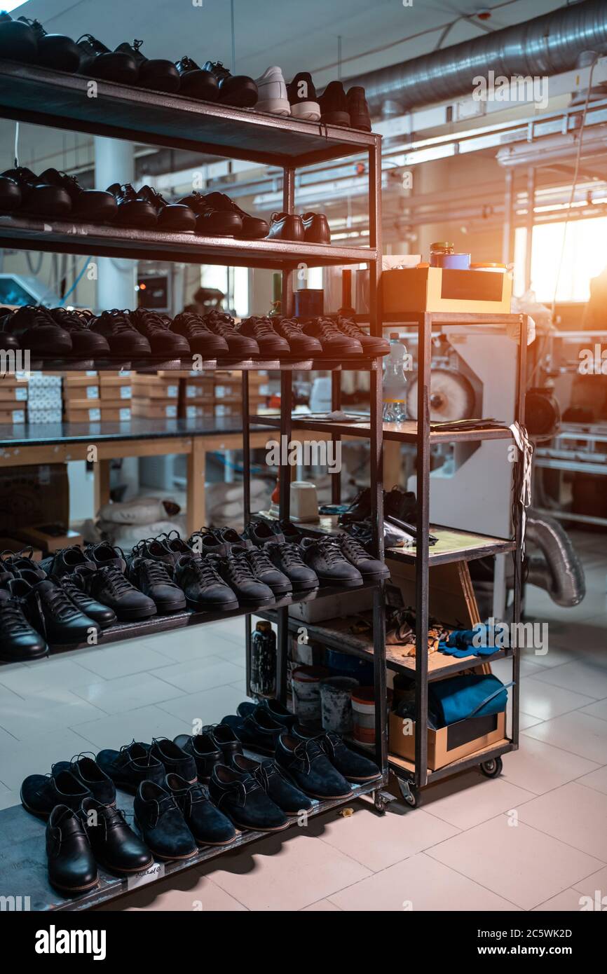 shelf with leather man shoes on modern footwear factory Stock Photo - Alamy
