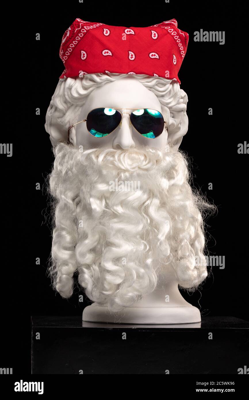 White plaster statue of a bust of Apollo Belvedere with a long white ...