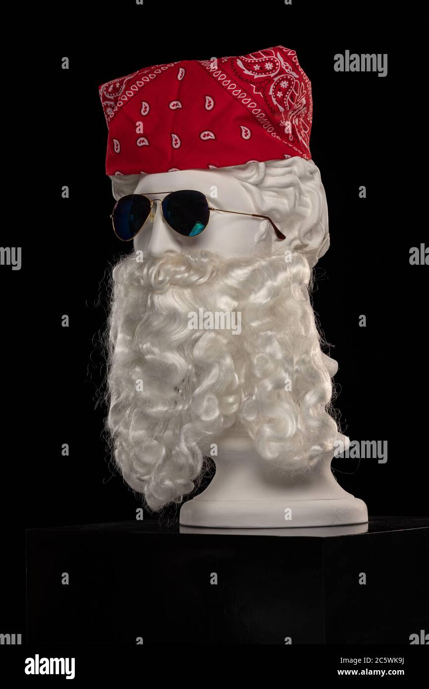 White plaster statue of a bust of Apollo Belvedere with a long white ...