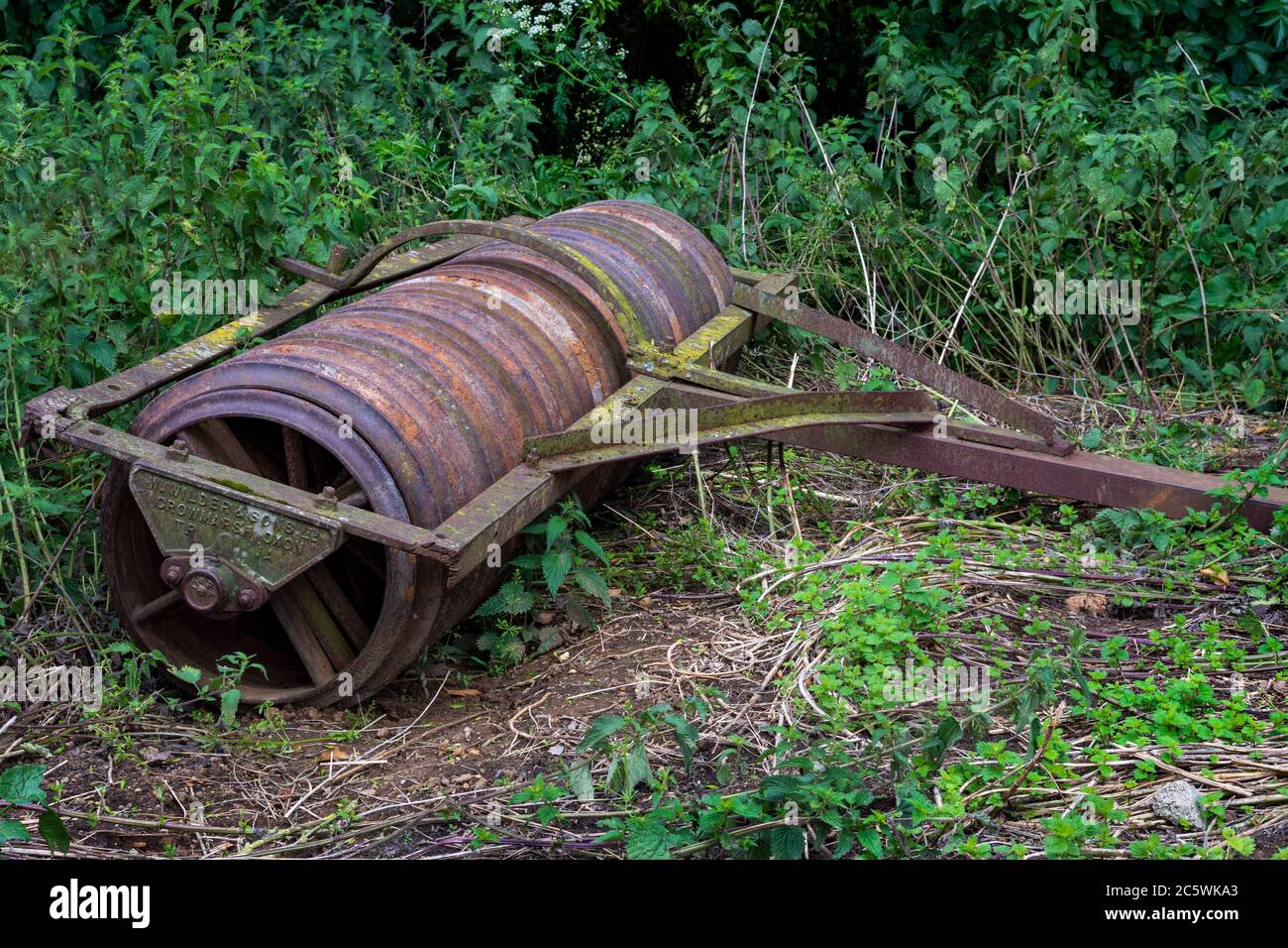 An old farm roller used for rolling arable crops to encourage strong ...