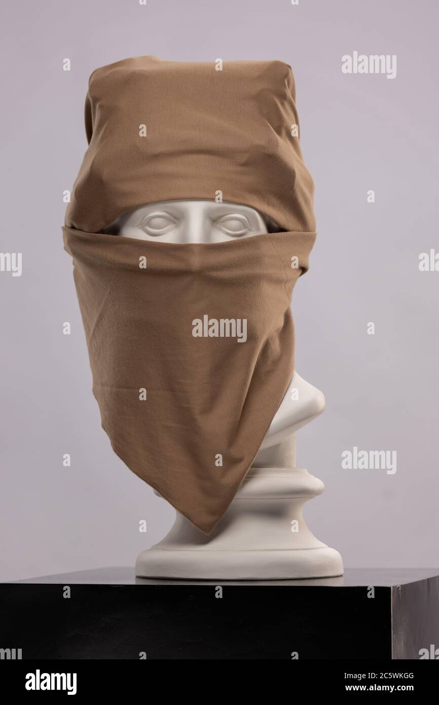 White plaster statue of a bust of Apollo Belvedere in hijab niqab Stock ...