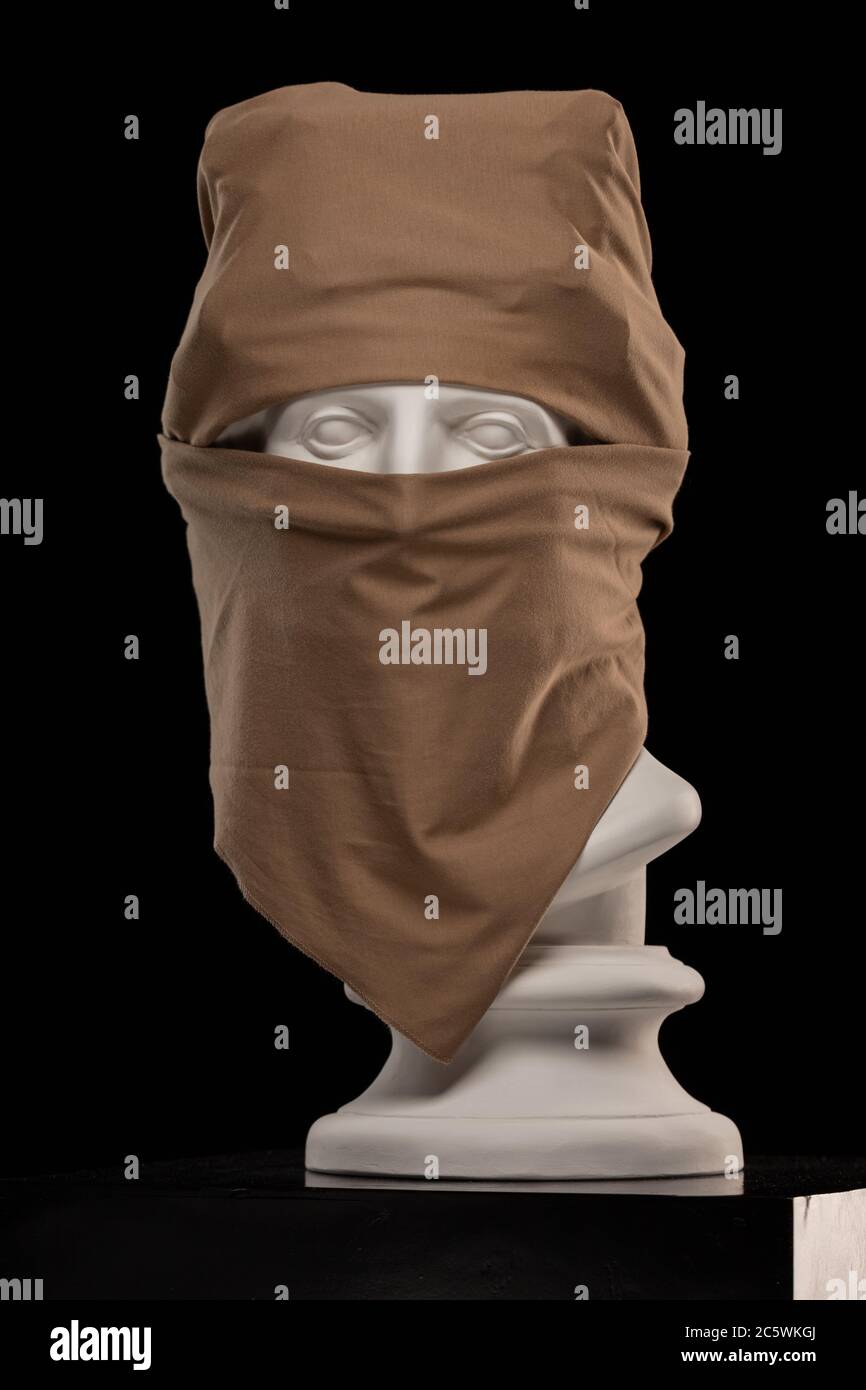 White plaster statue of a bust of Apollo Belvedere in hijab niqab Stock ...