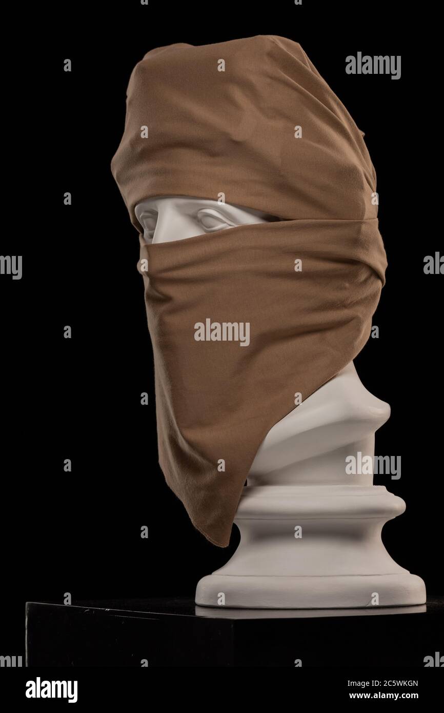 White plaster statue of a bust of Apollo Belvedere in hijab niqab Stock ...