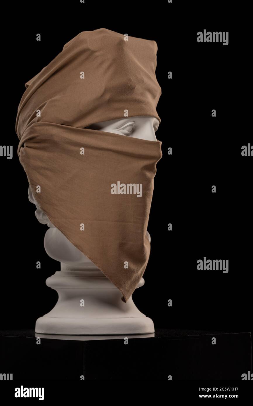 White plaster statue of a bust of Apollo Belvedere in hijab niqab Stock ...