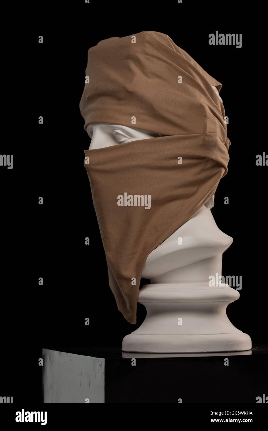 White plaster statue of a bust of Apollo Belvedere in hijab niqab Stock ...