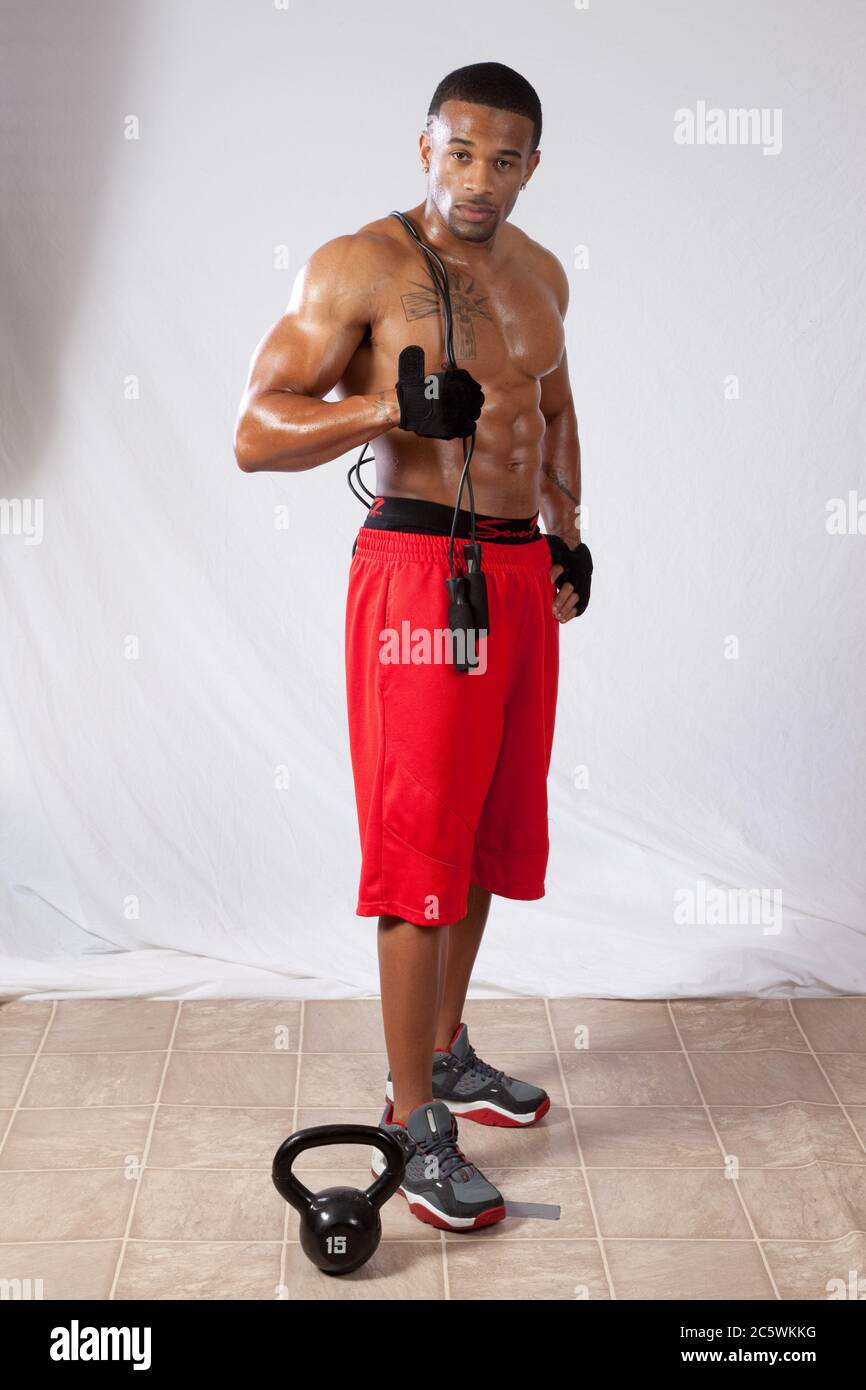 Strong Black man with a jump rope Stock Photo - Alamy