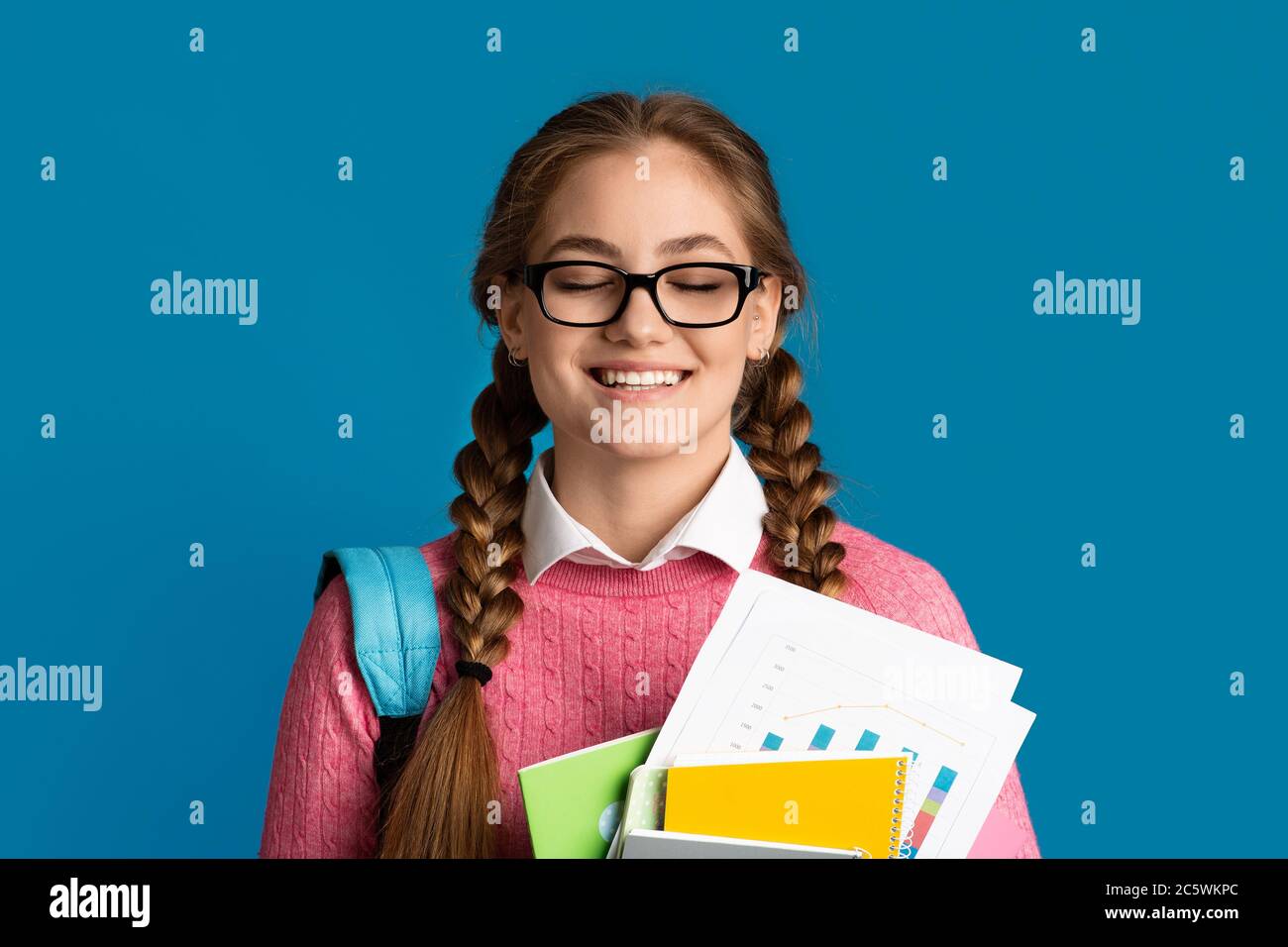 Pleasure of excellent test results. Girl with closed eyes holds ...