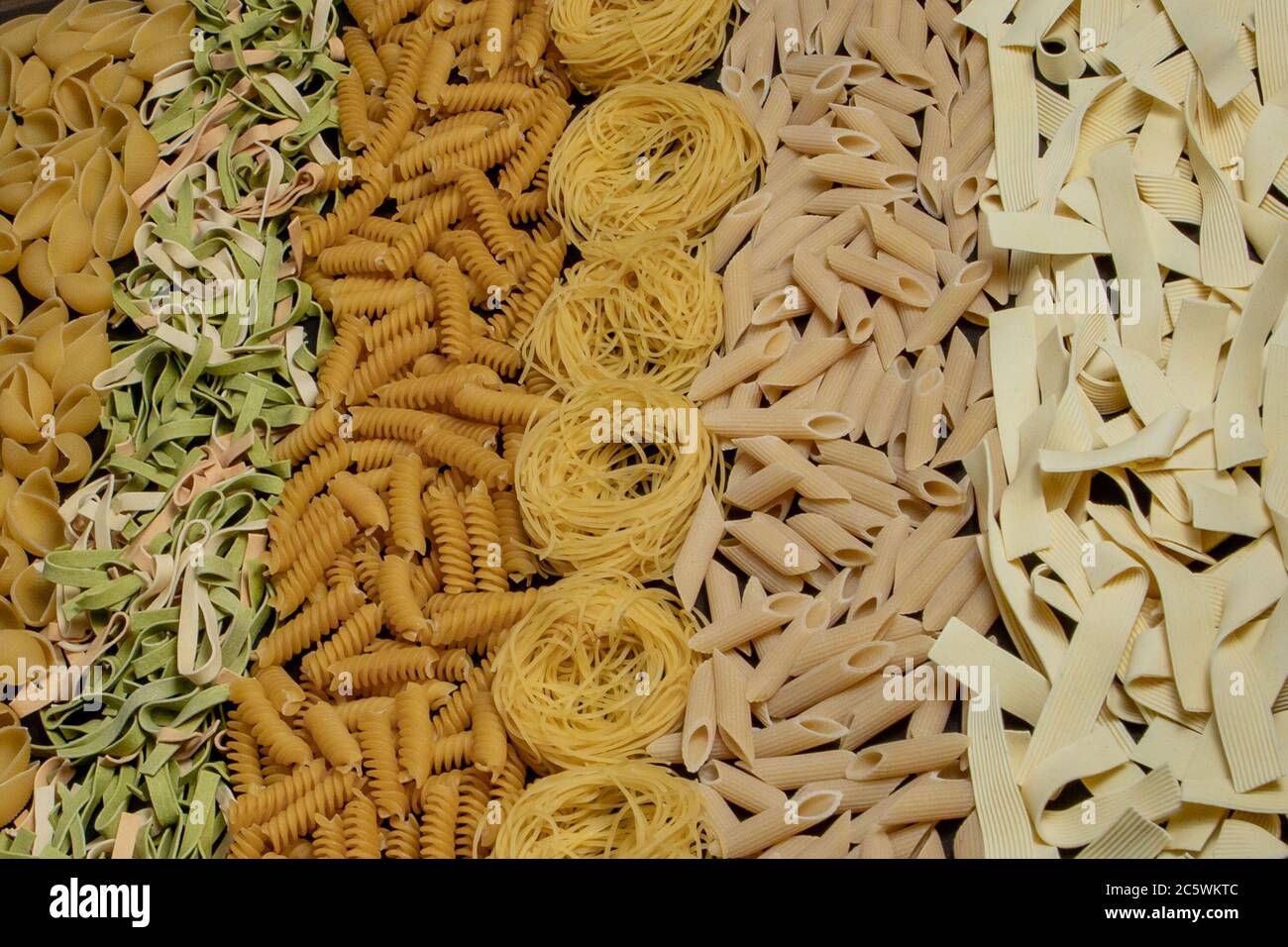 Variety of types and shapes of dry Italian pasta. Italian Macaroni raw ...