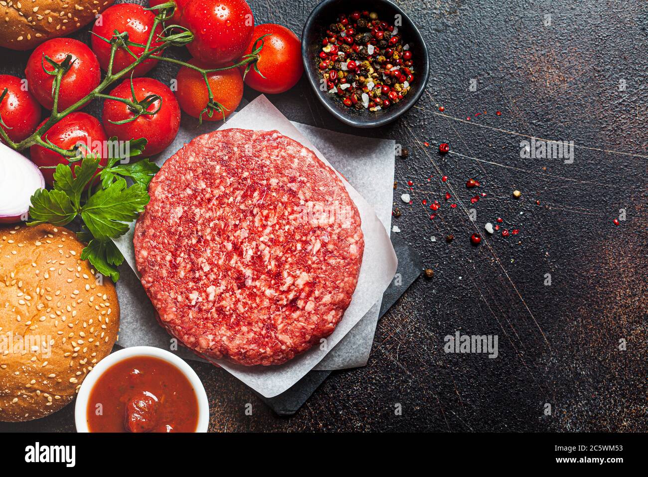 Raw ingredients for burgers, dark background, copy space. Cooking ...