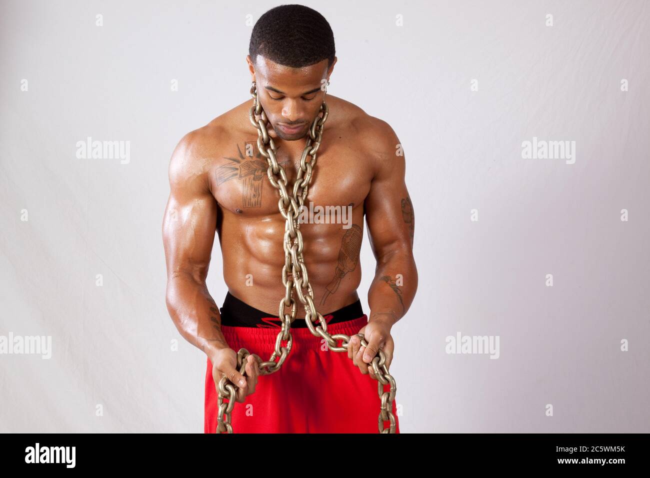 Fit black man with a chain Stock Photo - Alamy