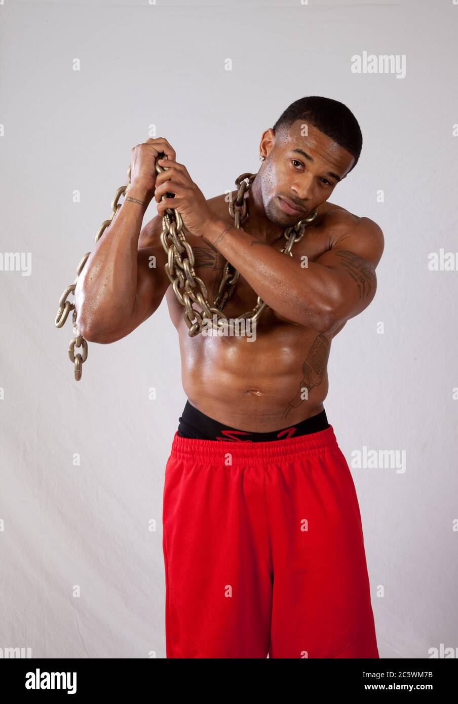 Fit black man with a chain Stock Photo - Alamy