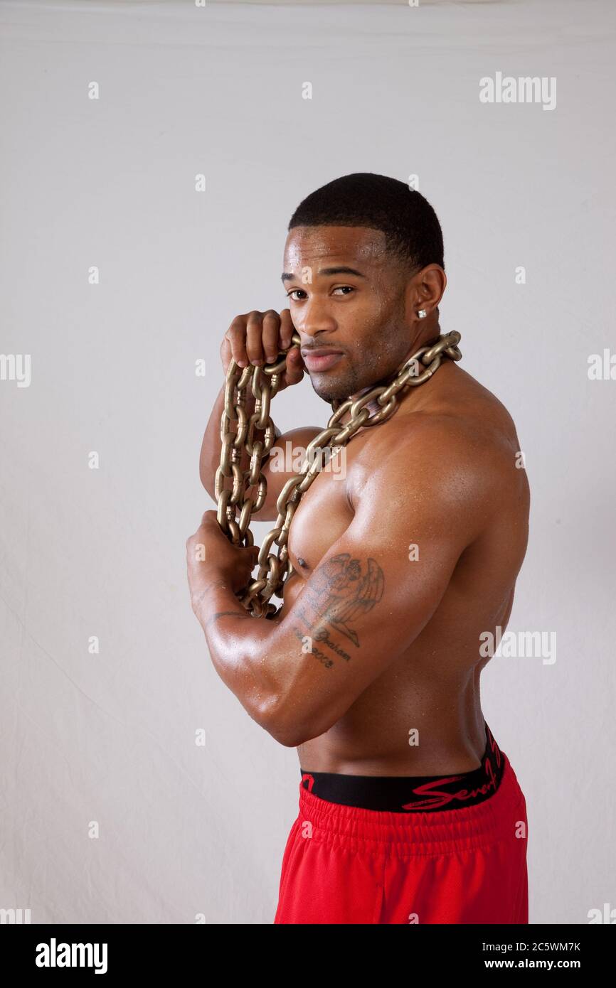 Fit black man with a chain Stock Photo - Alamy