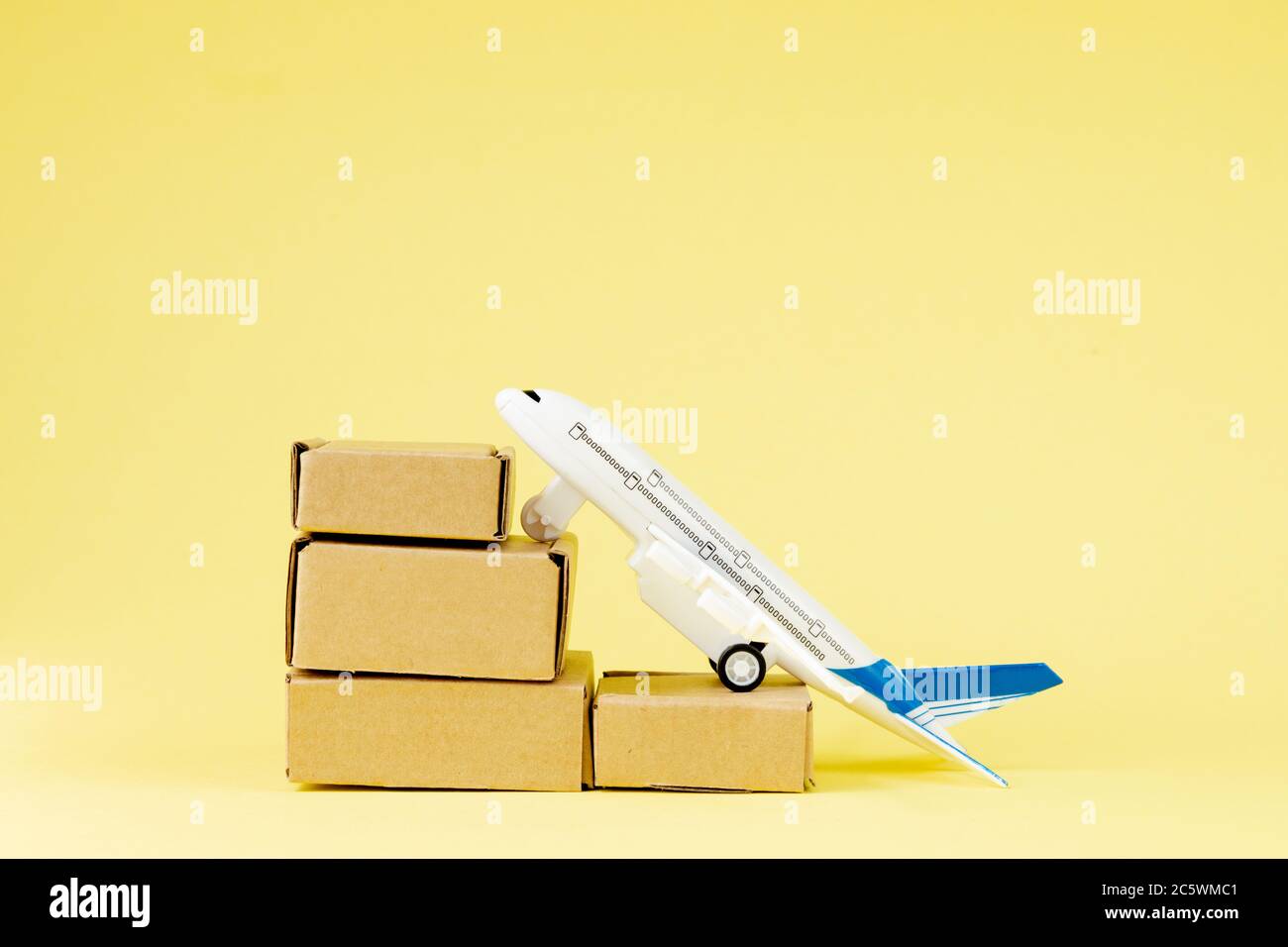 Airplane and stack of cardboard boxes. concept of air cargo and parcels ...