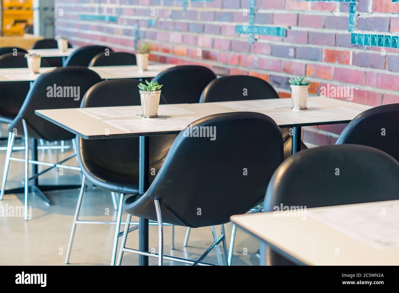 Modern Loft Cafe with brick wall interior design Stock Photo - Alamy