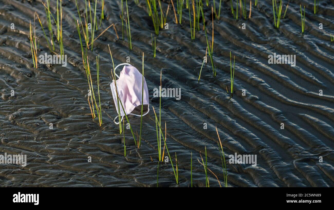 Coronavirus plastic waste polluting the environment. Disposable masks ...