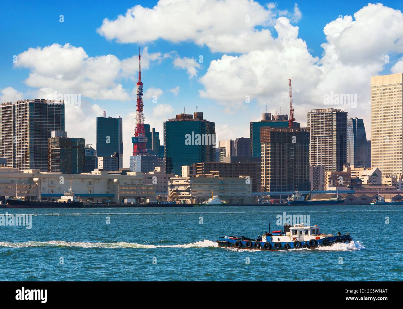 tokyo, japan - march 15 2020: Japanese tugboats sailing in front of the ...