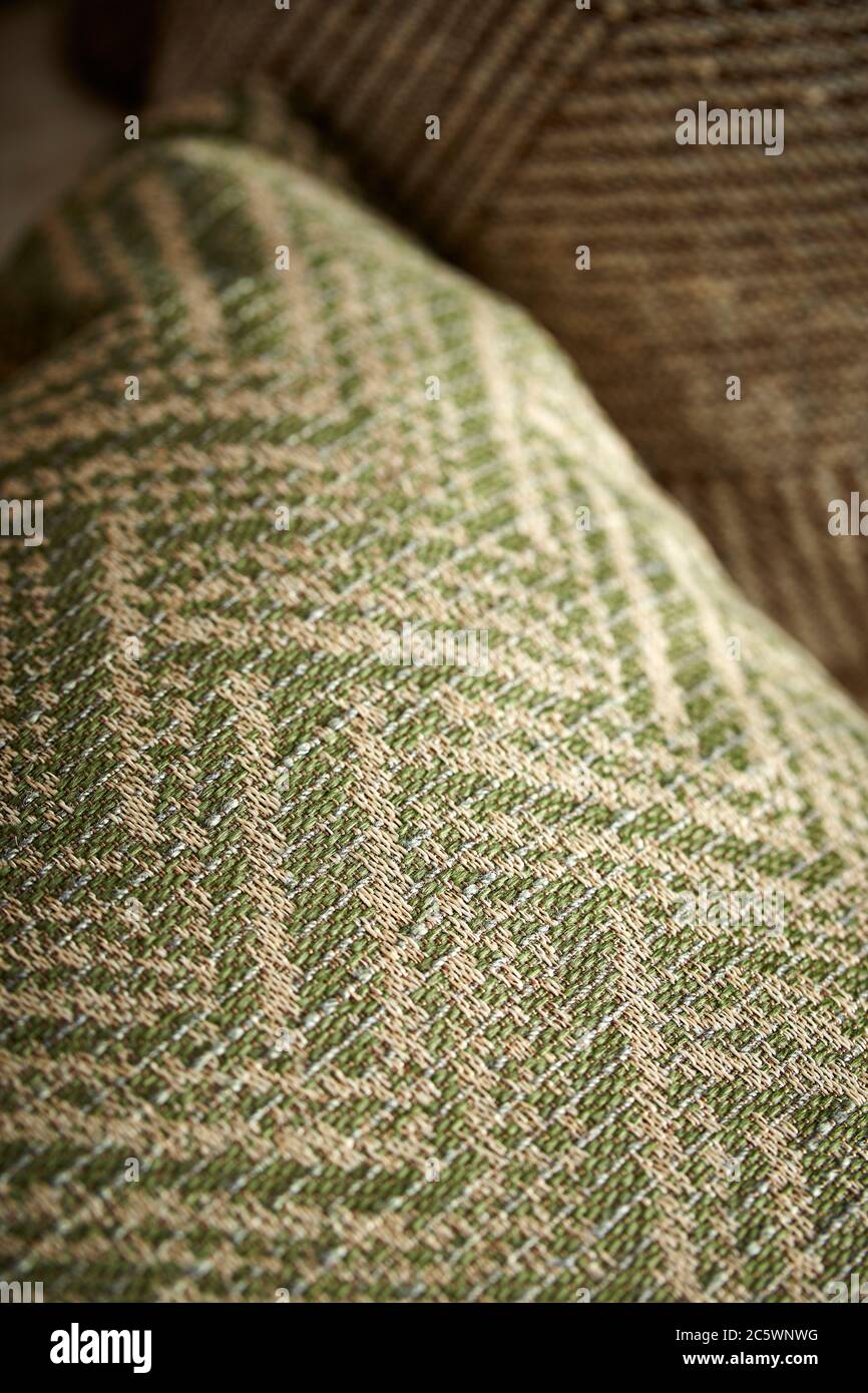 Close-up shot of geometric pattern pillows on a comfortable couch in ...