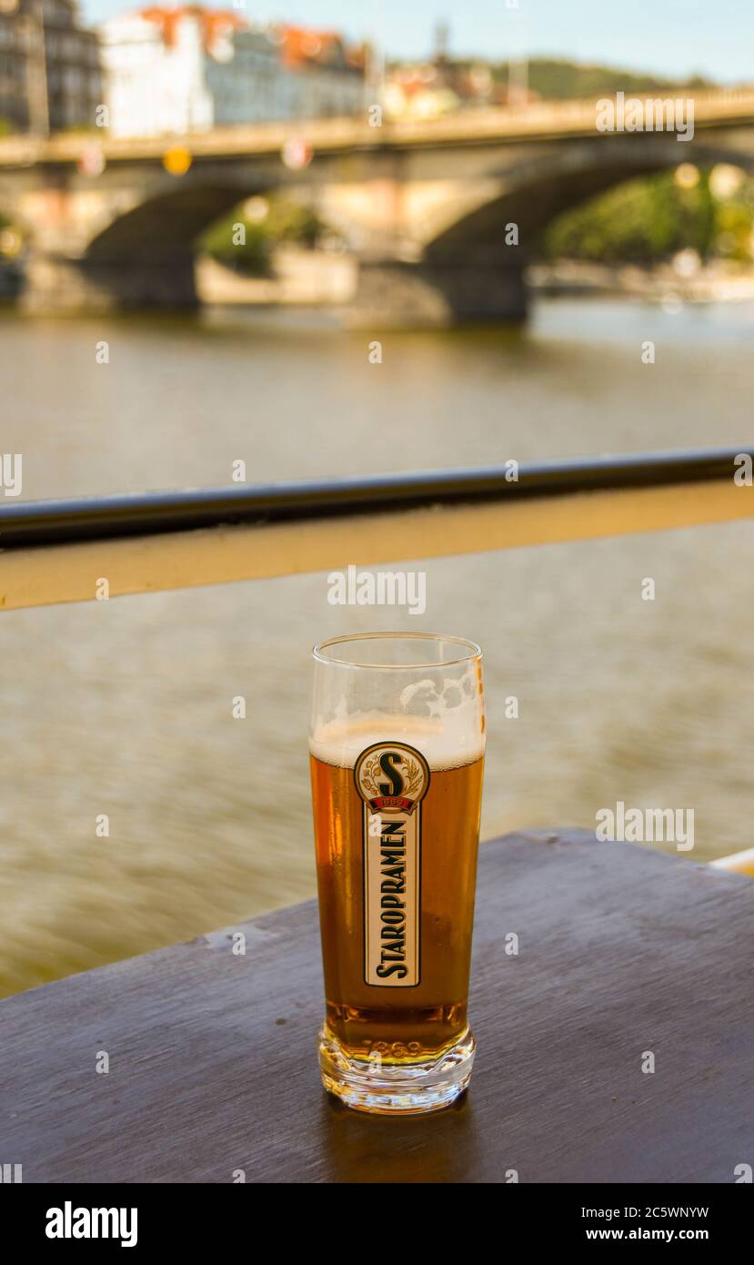 PRAGUE, CZECH REPUBLIC - AUGUST 2018: Glass of cold Czech pilsner beer ...