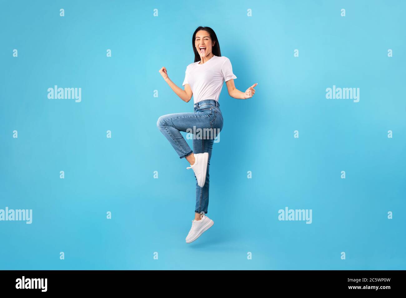 Woman happy jump hi-res stock photography and images - Alamy