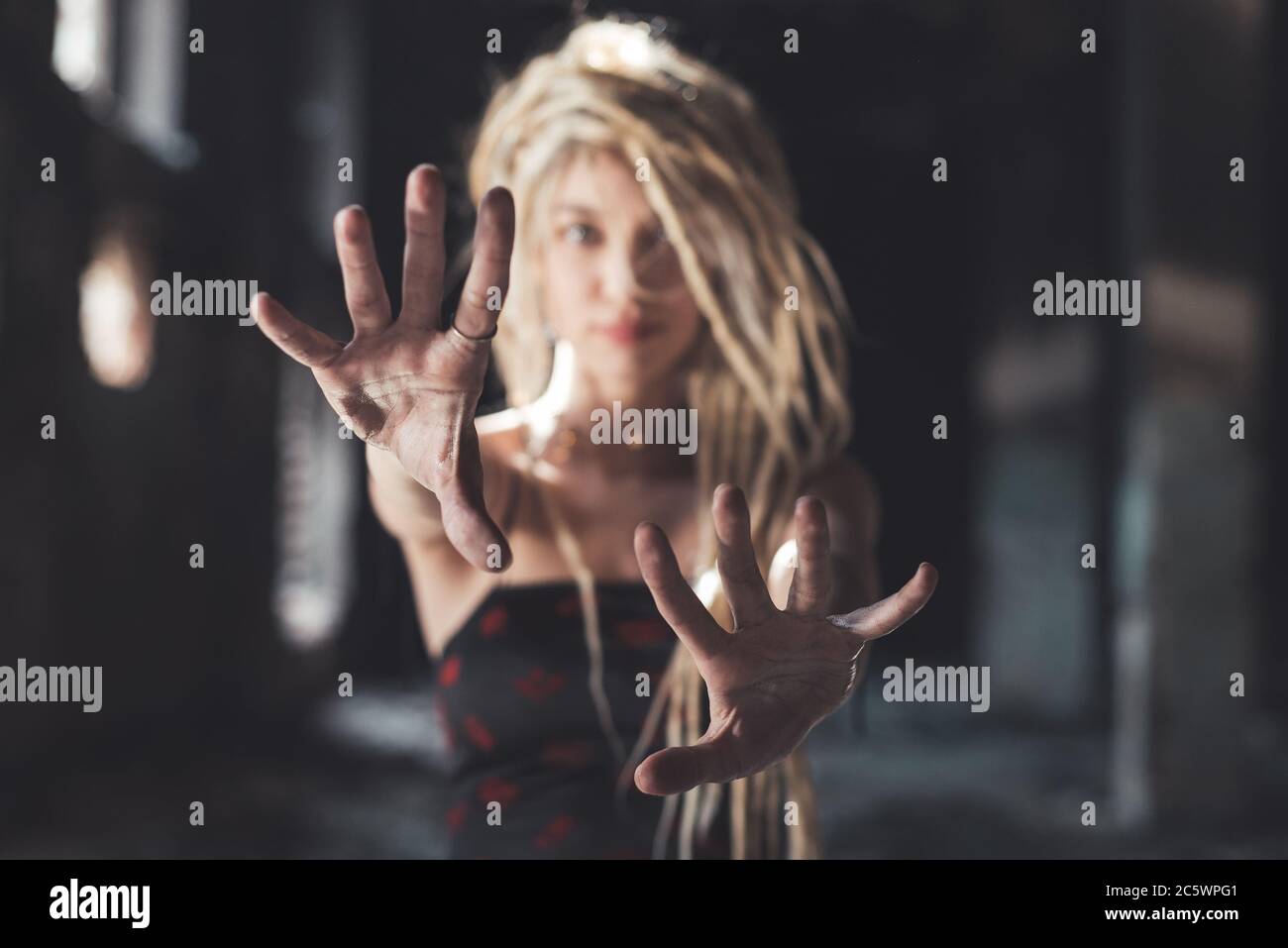 Young woman showing hands to camera Stock Photo - Alamy