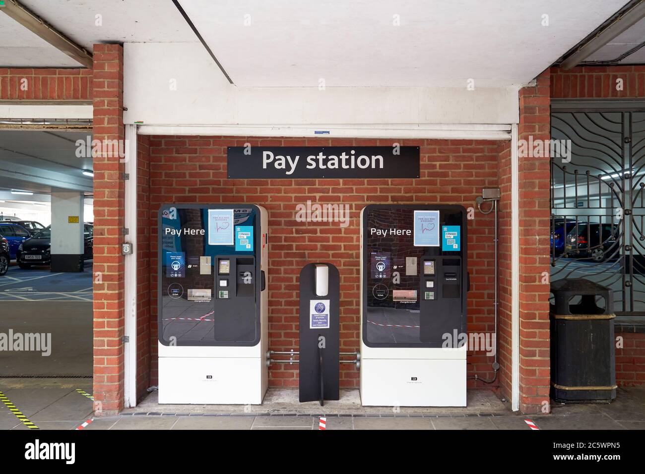 Car park pay station with hand sanitiser Stock Photo - Alamy