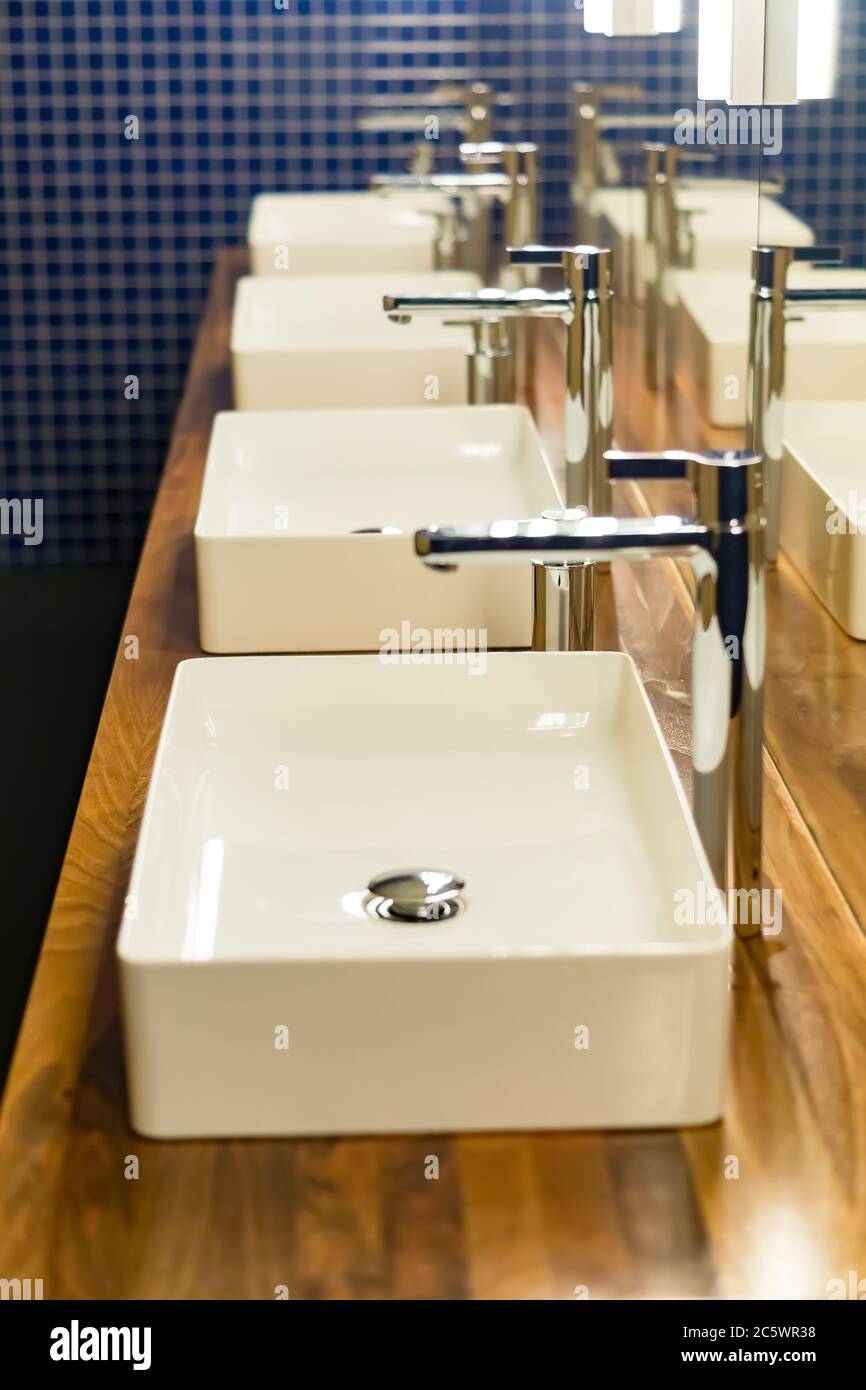Empty sinks in public restroom bathroom hi-res stock photography and ...
