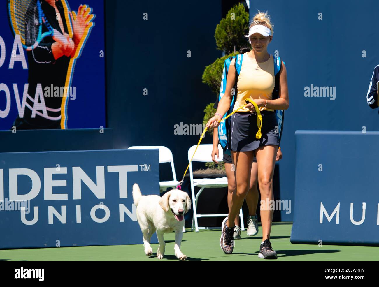 Amanda Anisimova of the United States walks onto the court for her ...